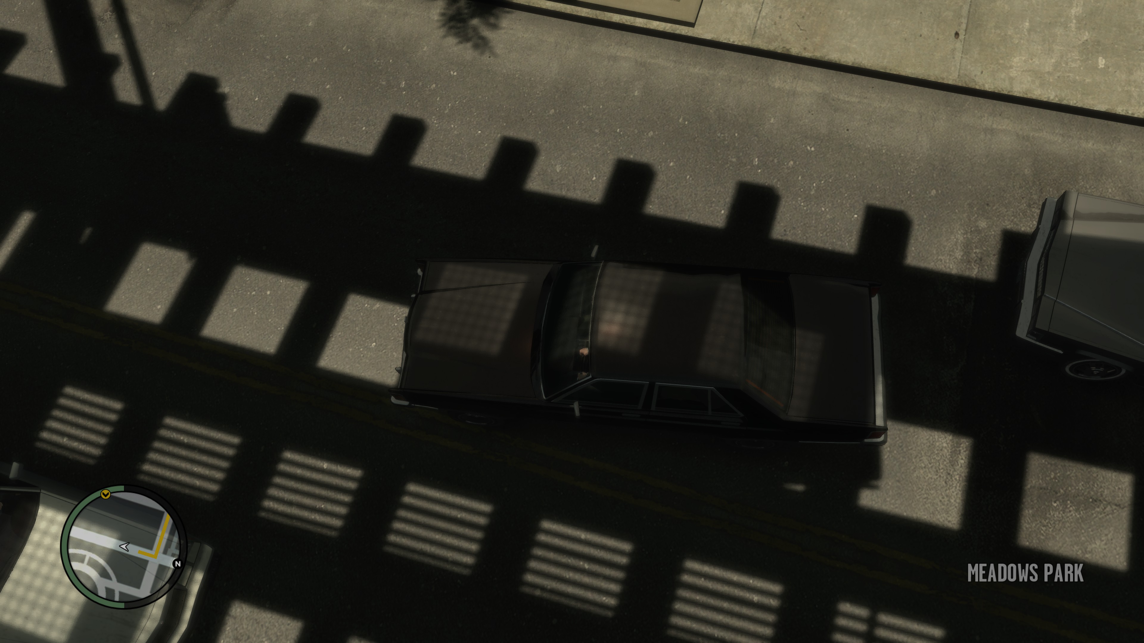Train tracks' mesh casts a shadow onto cars, but not onto the street ...