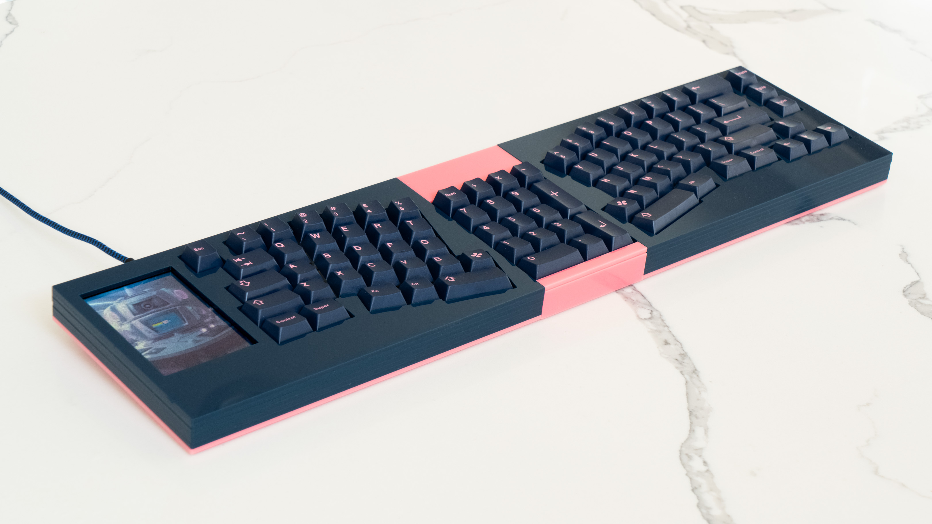 GitHub - dcpedit/midevil: Ergonomic keyboard with number pad in the middle