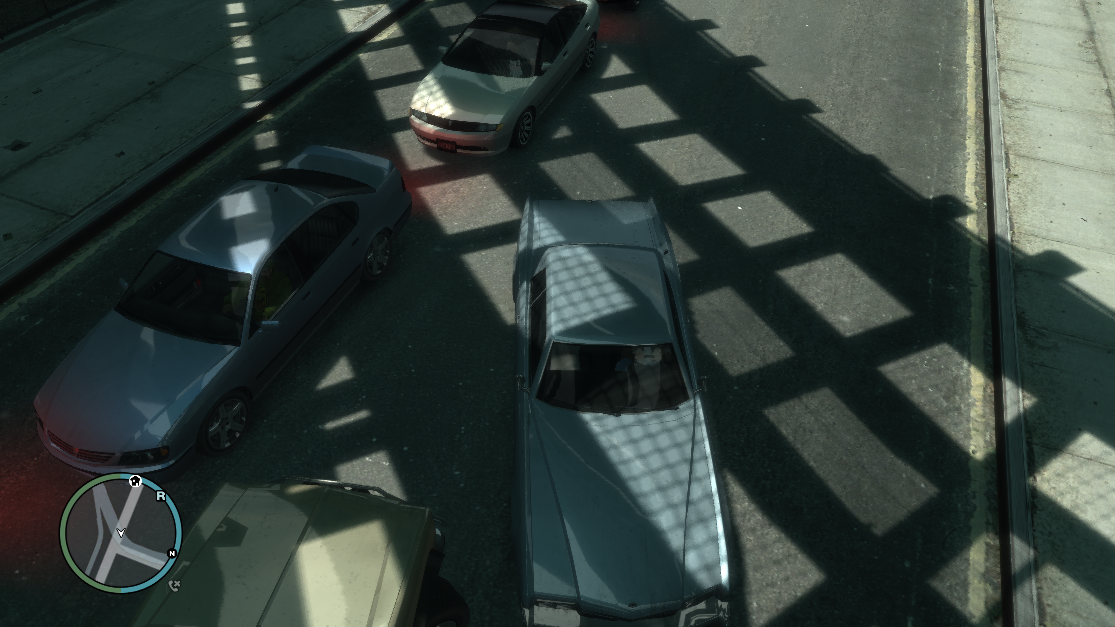 Train tracks' mesh casts a shadow onto cars, but not onto the street ...